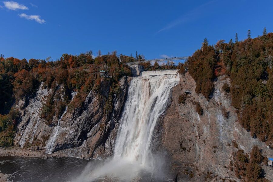 Montmorency Falls with autumn foliage and clear blue sky Quebec