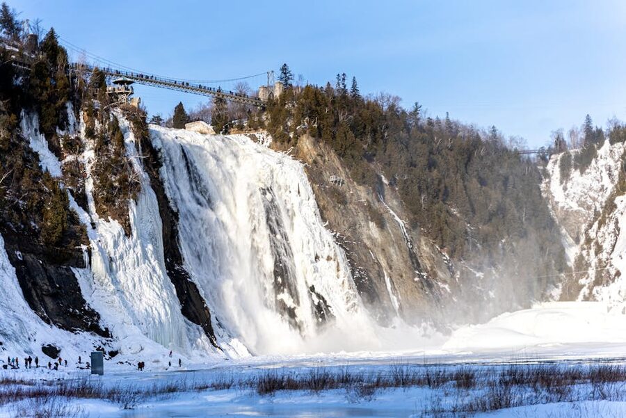 Montmorency Falls in winter with icy cascades and snow