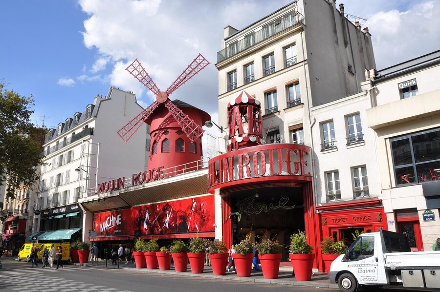 Moulin Rouge cabaret Paris exterior facade and red windmill sails