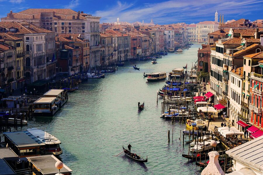 Venice Canale Grande with gondolier and city architecture