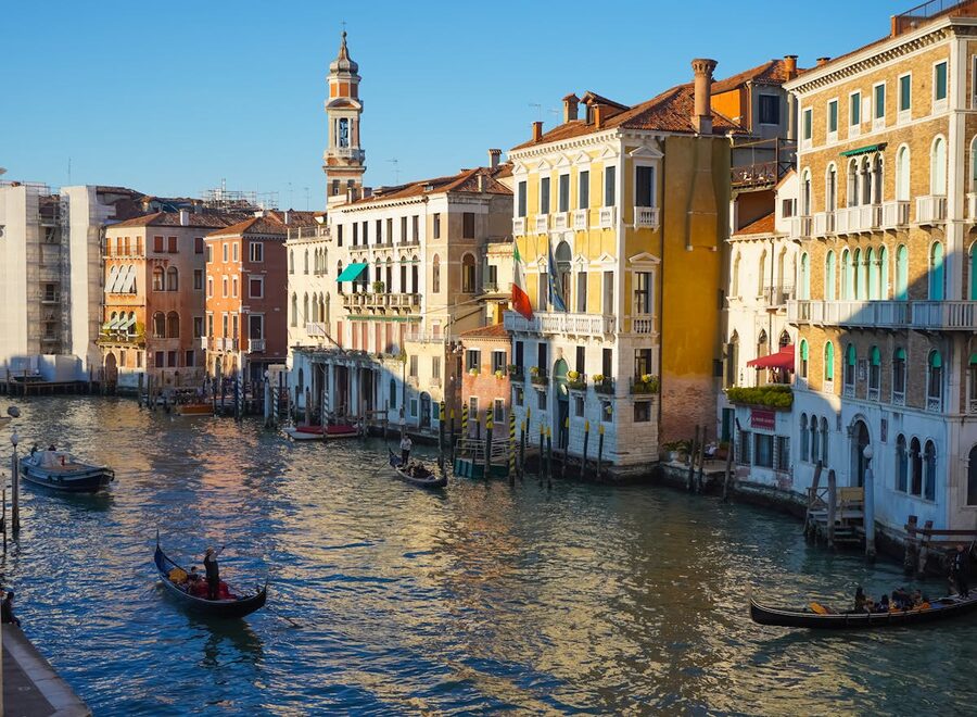 Gondolas navigating historic canals of Venice Italy scenic view