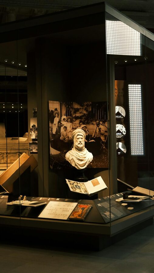 Museum display featuring historical artifacts and sculptures