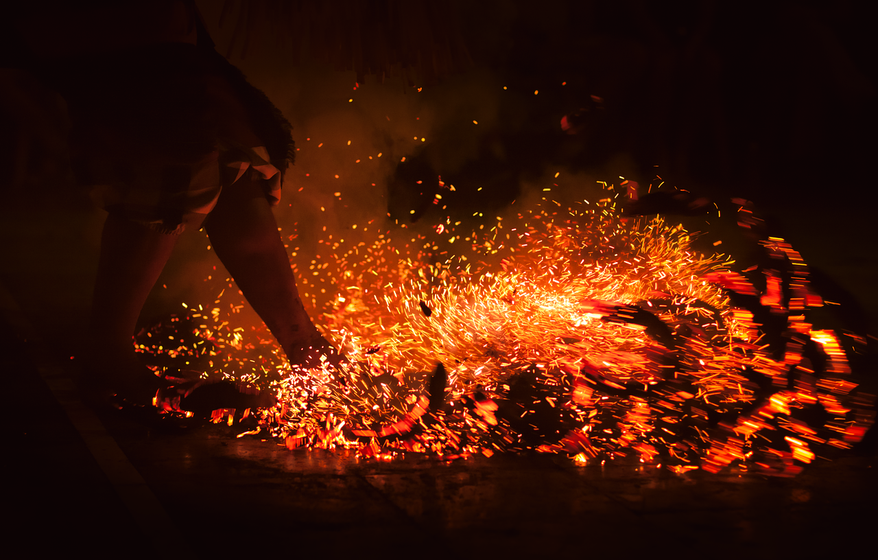 Fire dance embers and coconut husks at a Polynesian show