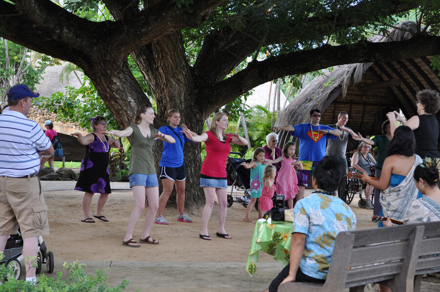 Audience hula dance lesson from a Polynesian cultural performer