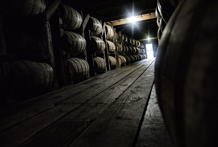 Bourbon whiskey barrels aging in a distillery