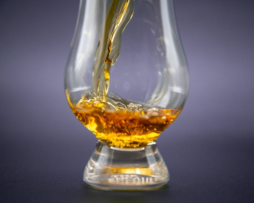 Bourbon whiskey pour into glass