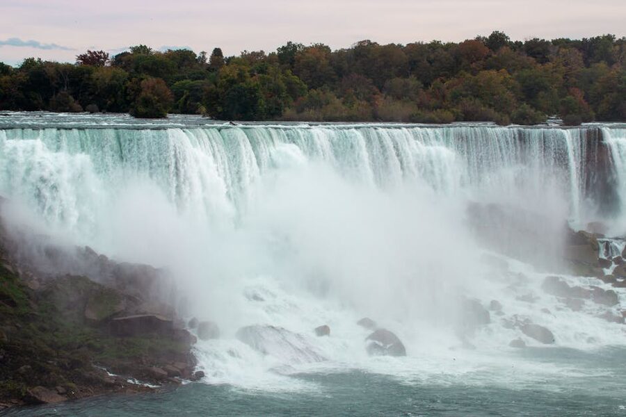 Niagara Falls with autumn foliage and mist rising from the gorge