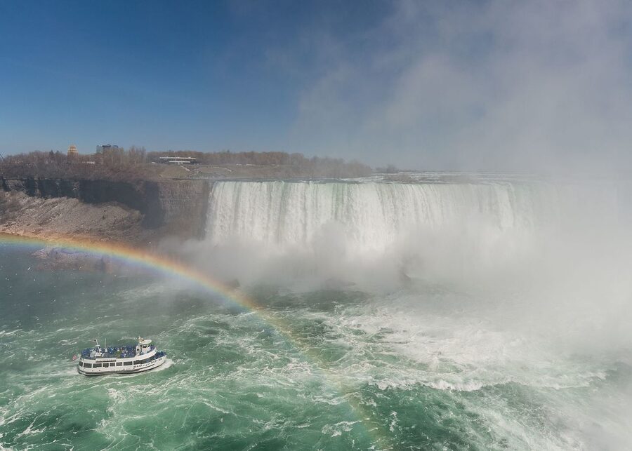 Maid of the Mist approaching Horseshoe Falls with blue poncho passengers