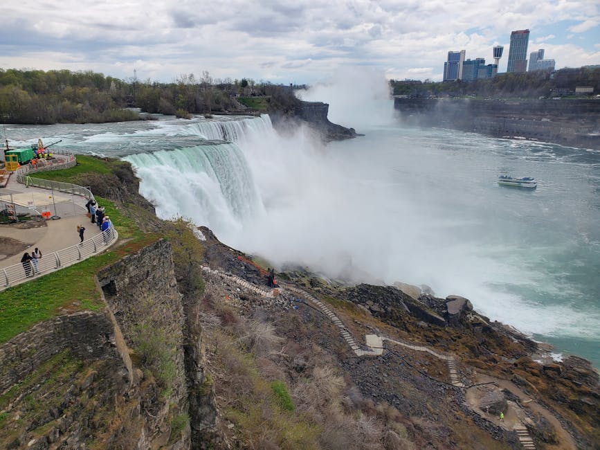Aerial view of Niagara Falls with mist rising from the horseshoe