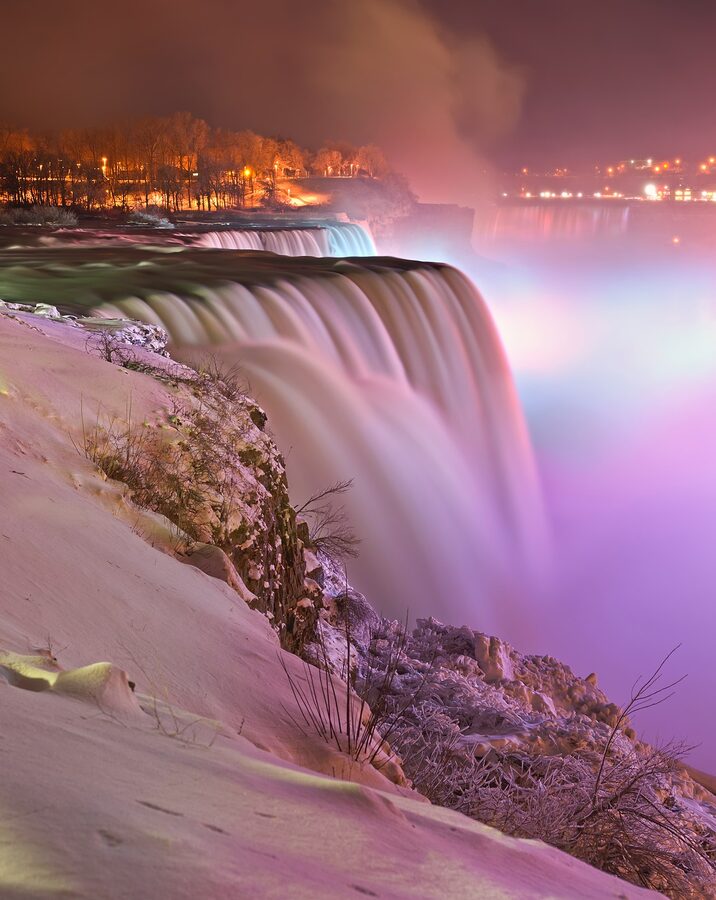 Niagara Falls illuminated at night in winter from Prospect Point