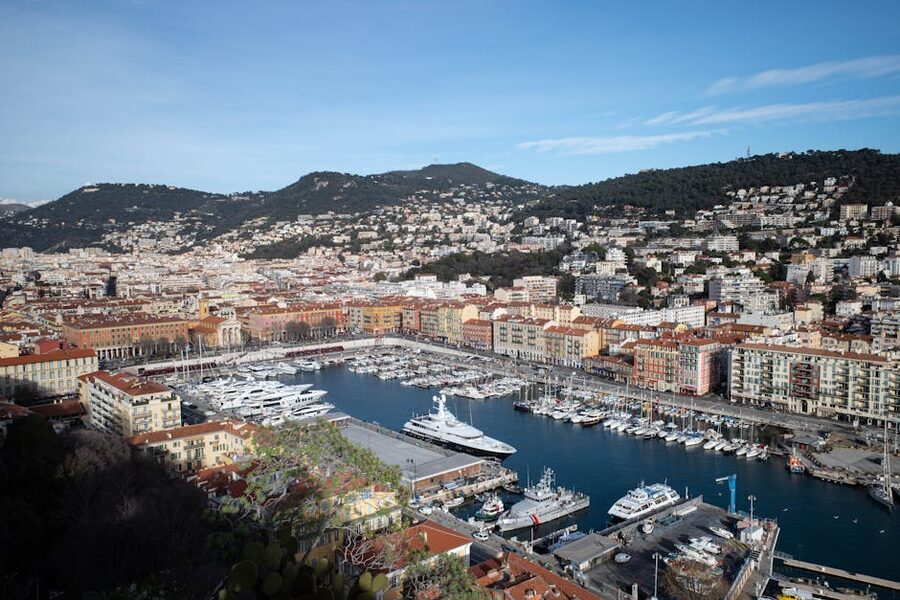Nice Port Lympia harbor with yachts and historical buildings