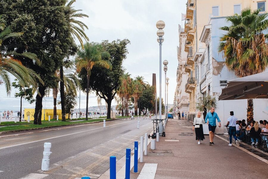 Promenade des Anglais sunny day people walking Nice France