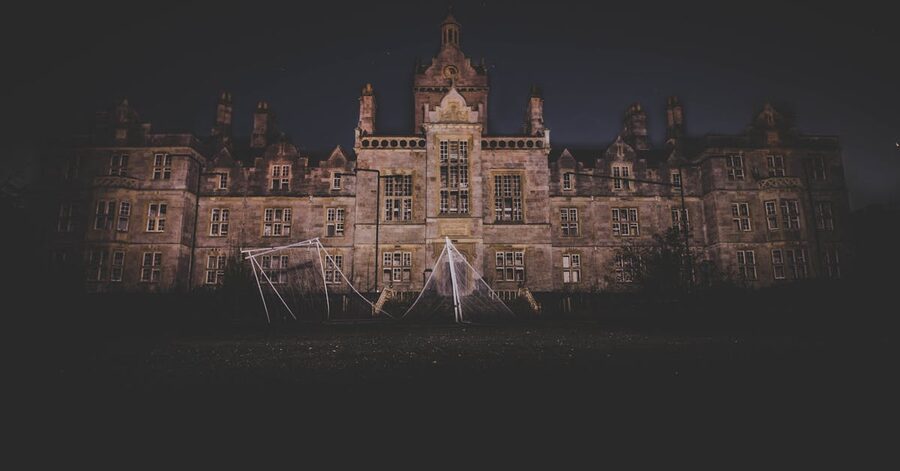 Eerie abandoned mansion at night gothic atmosphere