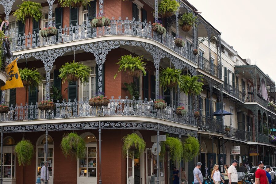 Wrought iron balconies and lush greenery French Quarter New Orleans