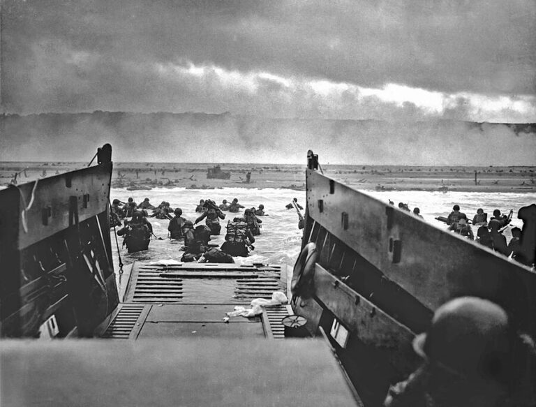 American troops and ships landing on Normandy beach during D-Day June 1944
