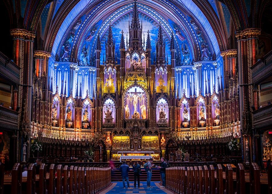 Blue vaulted Gothic interior of Notre-Dame Basilica in Montreal