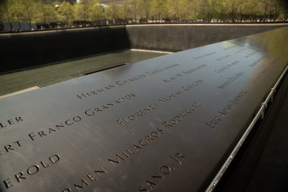 Close-up of engraved names at the 9/11 Memorial