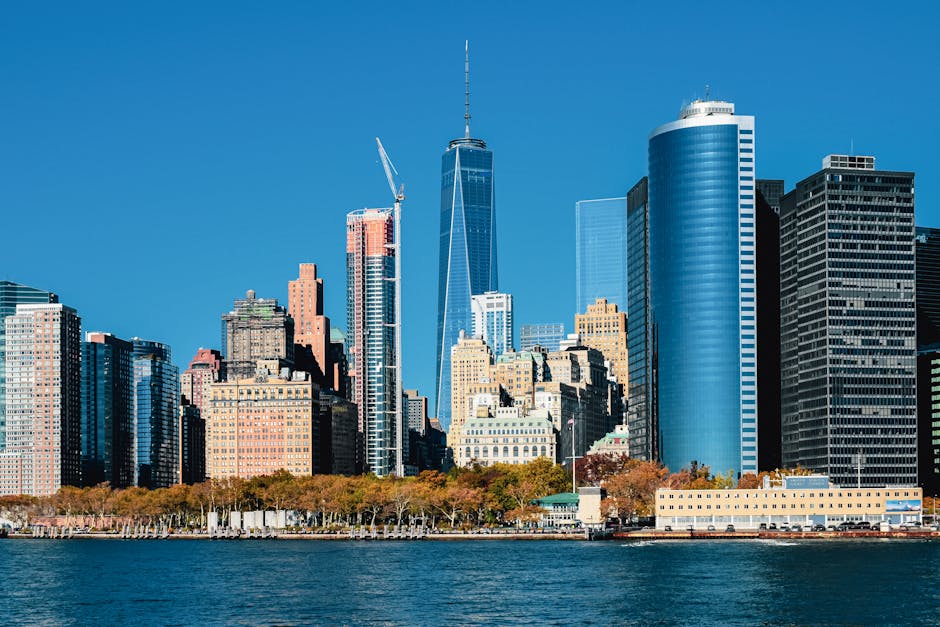 Lower Manhattan skyline with skyscrapers under blue sky