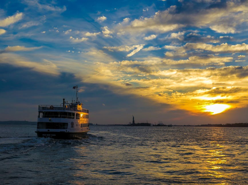 Ferry at sunset with Statue of Liberty