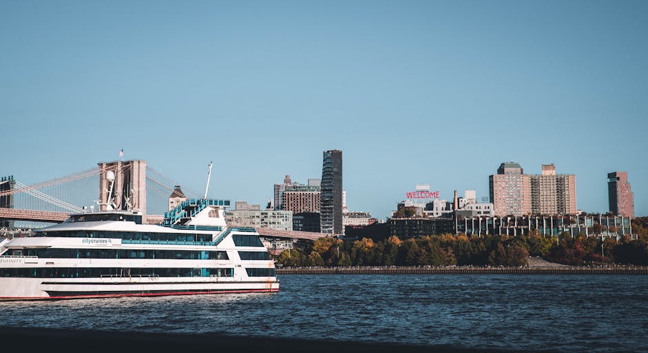 Cruise ship on East River with NYC skyline and Brooklyn Bridge