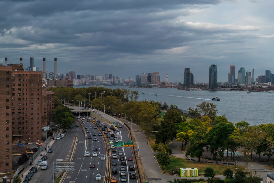 Visitors on the Edge outdoor observation deck with glass floor panels and city views