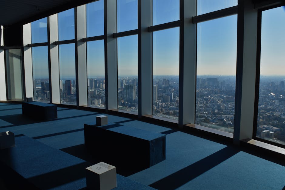Edge City Climb experience with participants harnessed on the exterior of the building