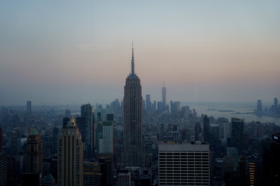 NYC skyline at dusk with Empire State in purple light