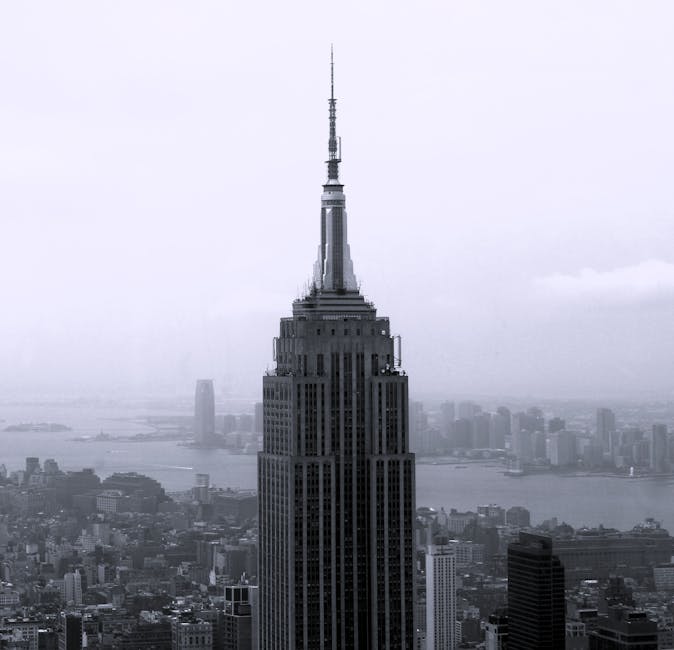 Empire State Building against misty sky