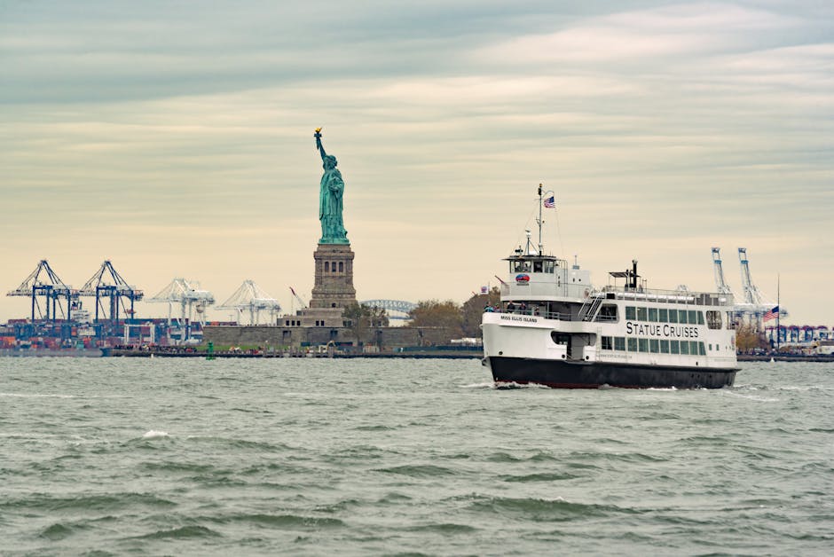 Ferry cruises past Statue of Liberty in New York Harbor