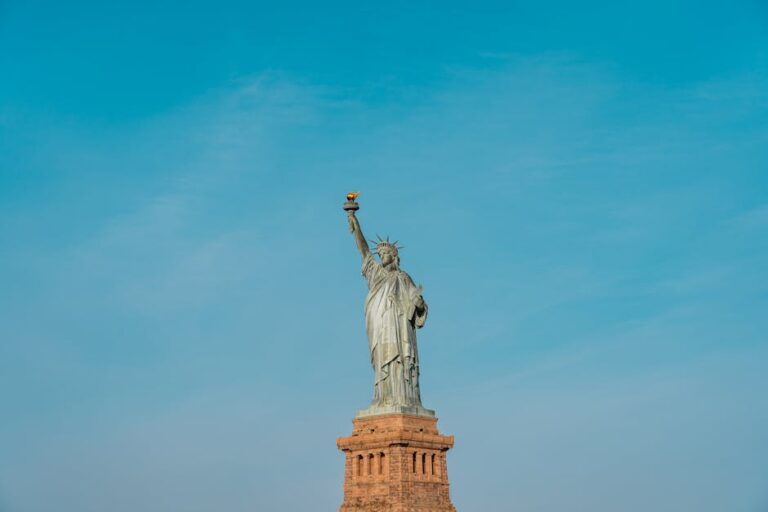 Statue of Liberty against clear blue sky in New York
