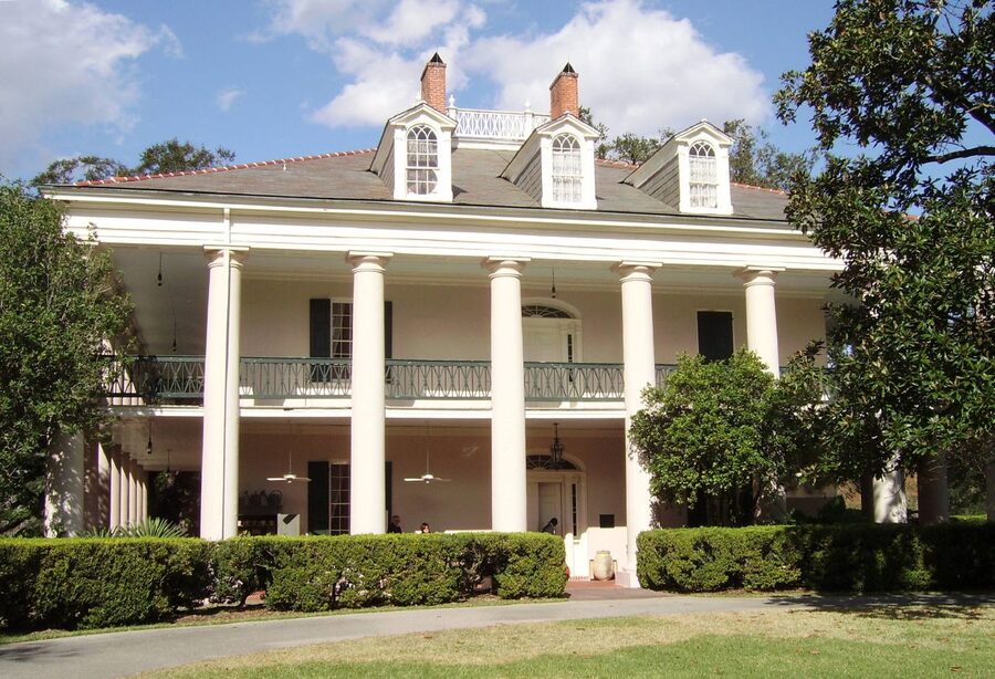 Oak Alley Plantation house viewed through the famous canopy of 28 live oak trees