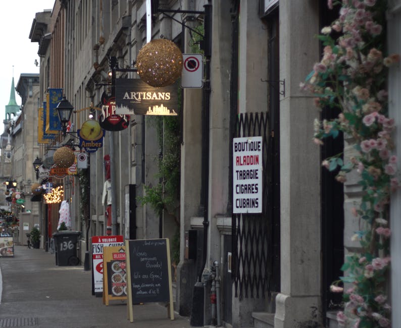 Old Montreal cobblestone street with historic shops and signs