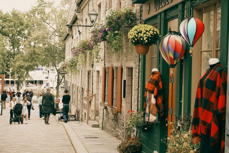 Summer street with colorful flowers and decorations in Old Quebec
