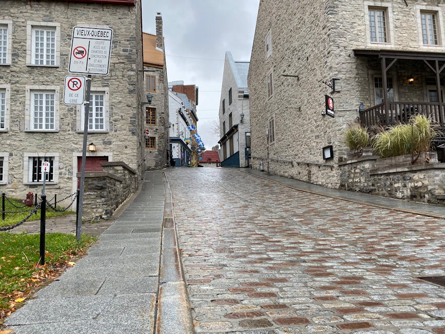 Cobbled stone street with historic stone buildings in Old Quebec City