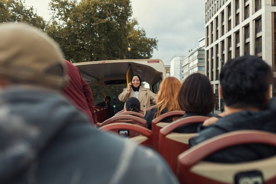 Tourists on an open-top sightseeing bus