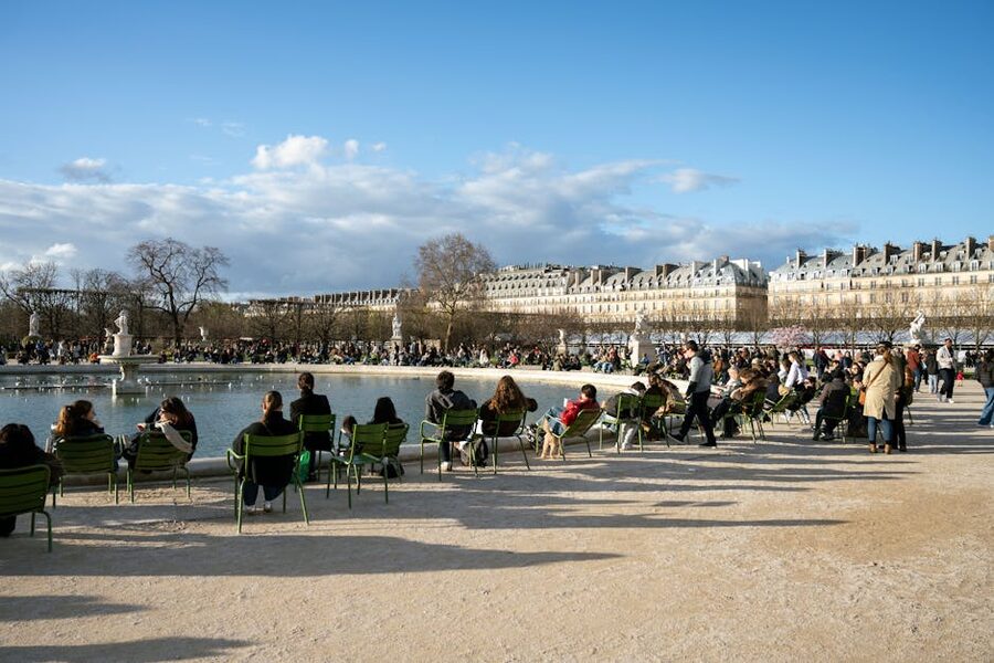 People relaxing in the Jardin des Tuileries on a sunny day in Paris