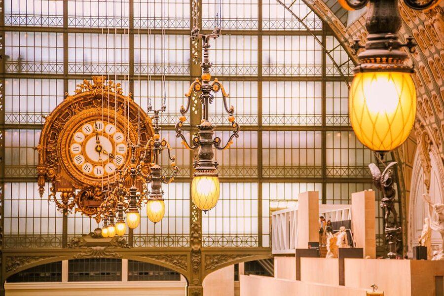 Musee d'Orsay clock and ornate light fixtures detail