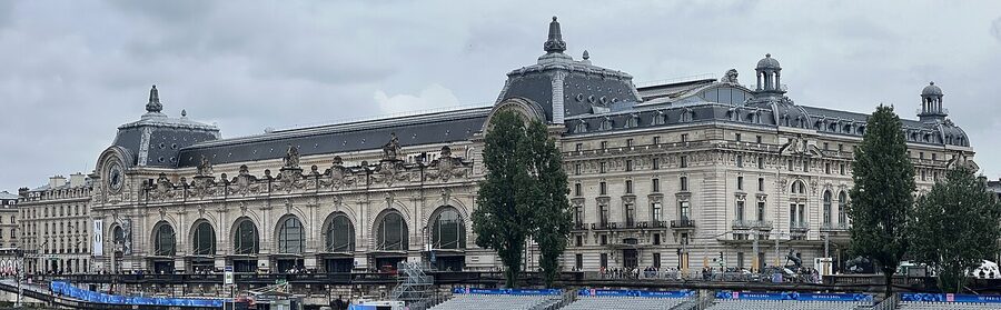 Musee d'Orsay exterior facade seen across the Seine river Paris