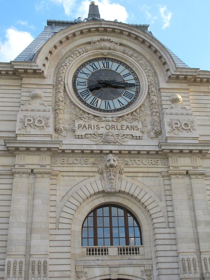 The giant clock window of the Musee d'Orsay overlooking Paris