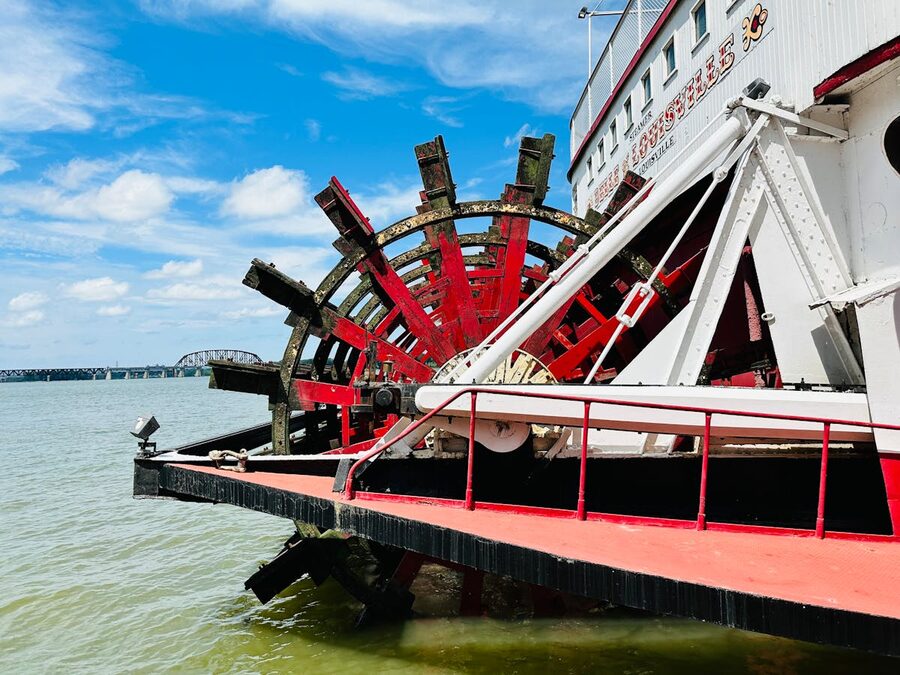 Close-up view of a large paddle wheel on a historic river steamboat