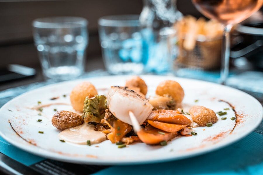 French plated scallop dish at a Paris restaurant