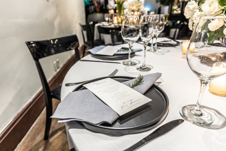Elegant table setting with menu and wine glasses for cabaret dinner