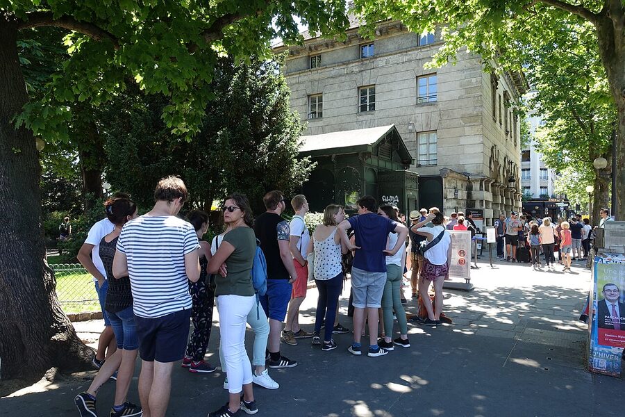 Long queue of visitors outside the Catacombs entrance at place Denfert-Rochereau in Paris