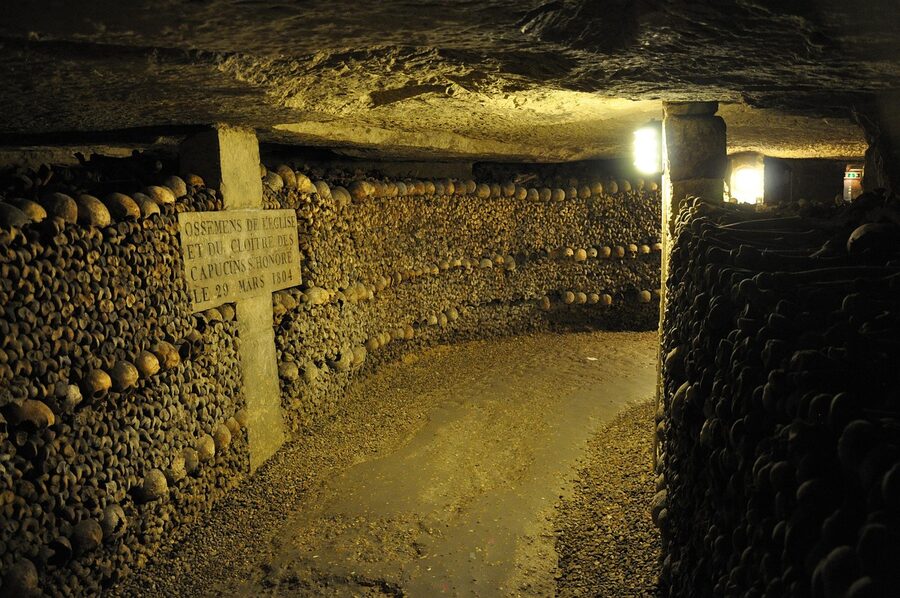 Bones and skulls arranged in the Paris Catacombs ossuary