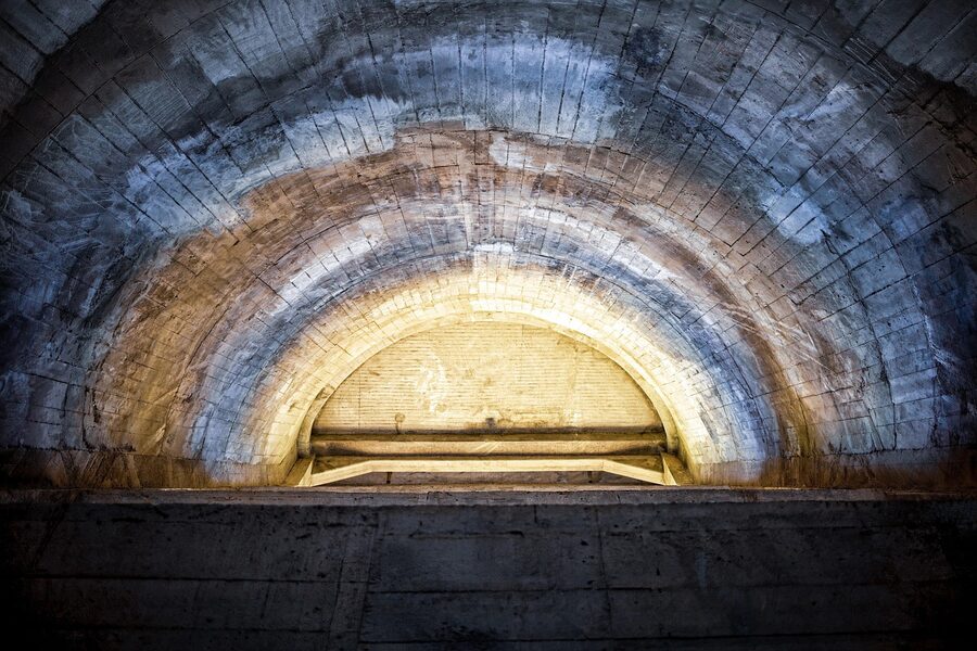Long underground tunnel inside the Paris Catacombs network