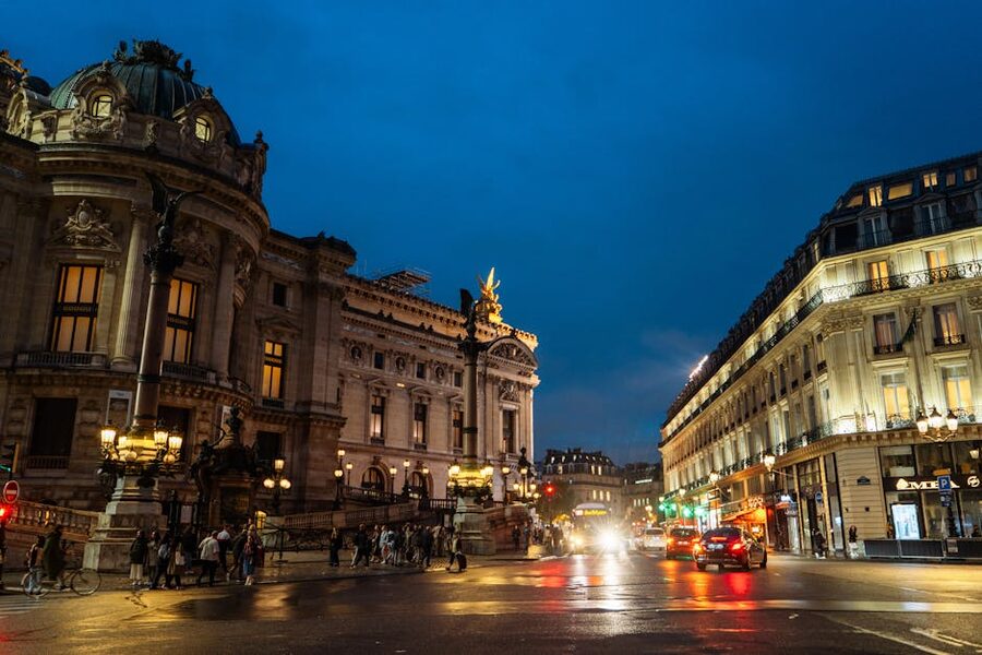 Opéra Garnier illuminated at night with Paris streets