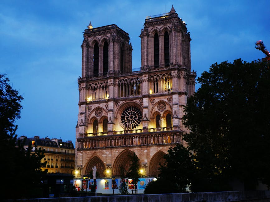 Notre Dame Cathedral illuminated at dusk in Paris