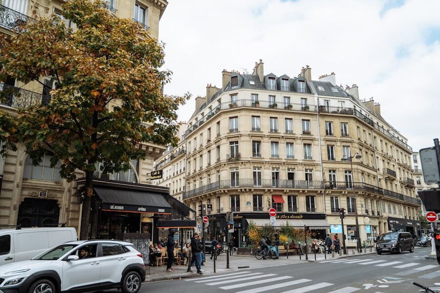 Paris autumn street with cobblestones and classic architecture