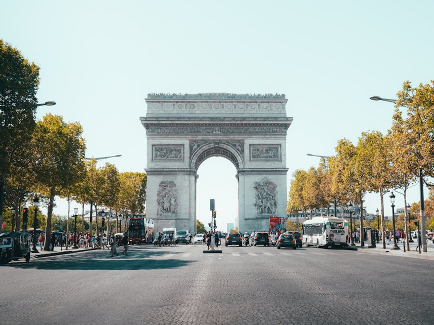 Arc de Triomphe with traffic at the roundabout Paris