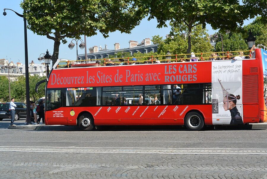 Les Cars Rouges Big Bus tour on Avenue des Champs-Elysees Paris